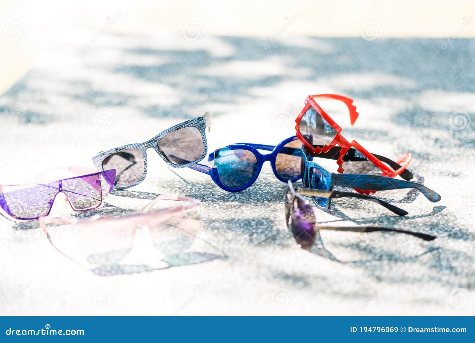 Collection of Multiple Sunglasses Models for Men and Women Stay on a ...