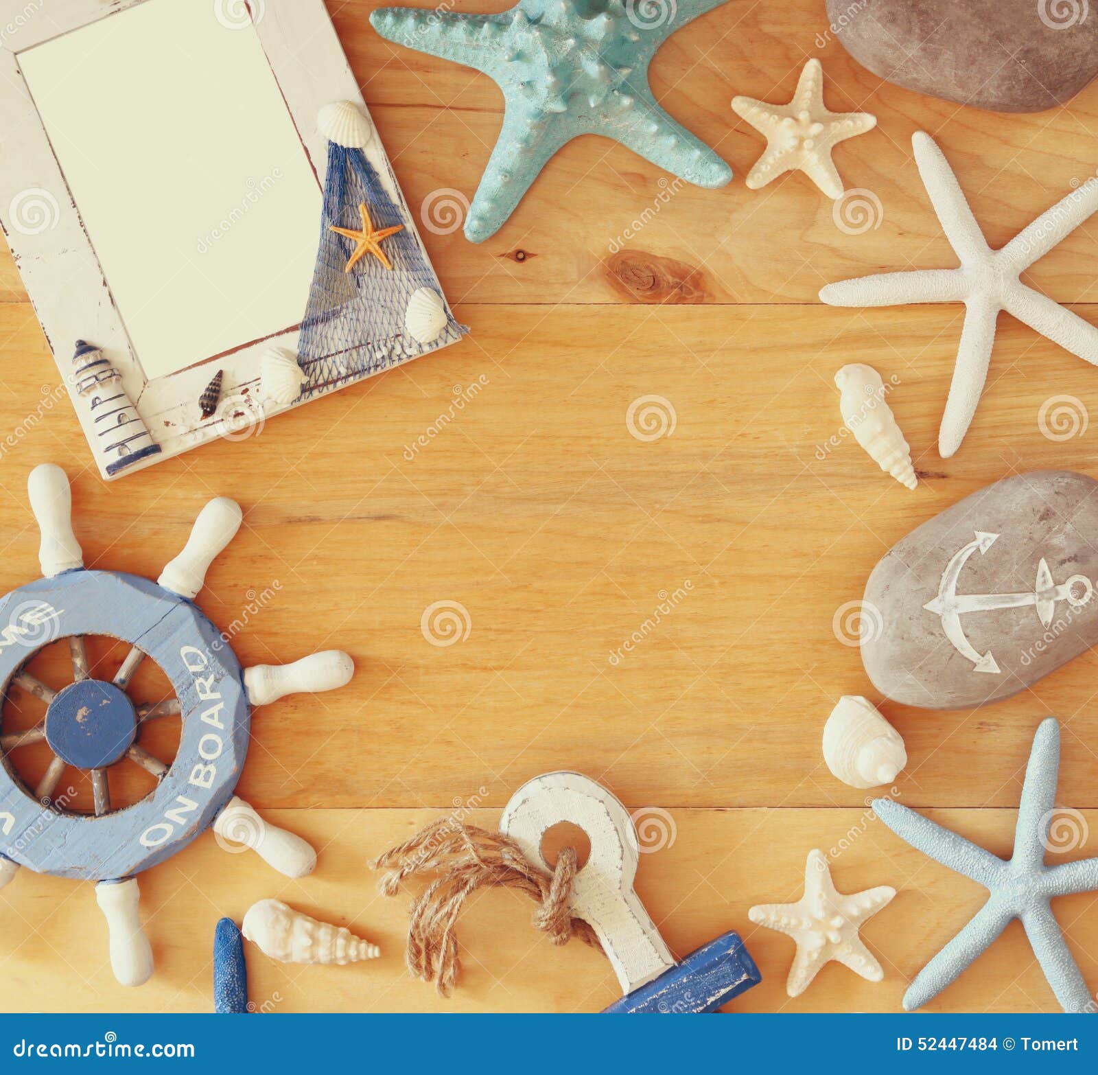 Collection of Nautical and Beach Objects Creating a Frame Over Wooden ...
