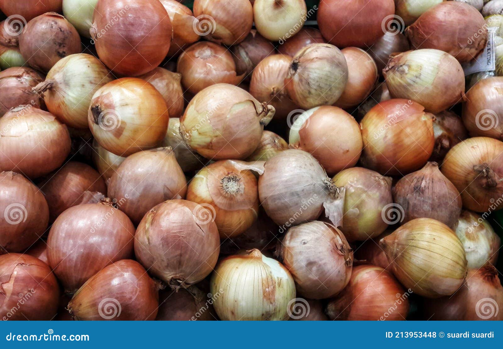 A Collection of Onions on Display for Sale in a Supermarket Stock Photo ...