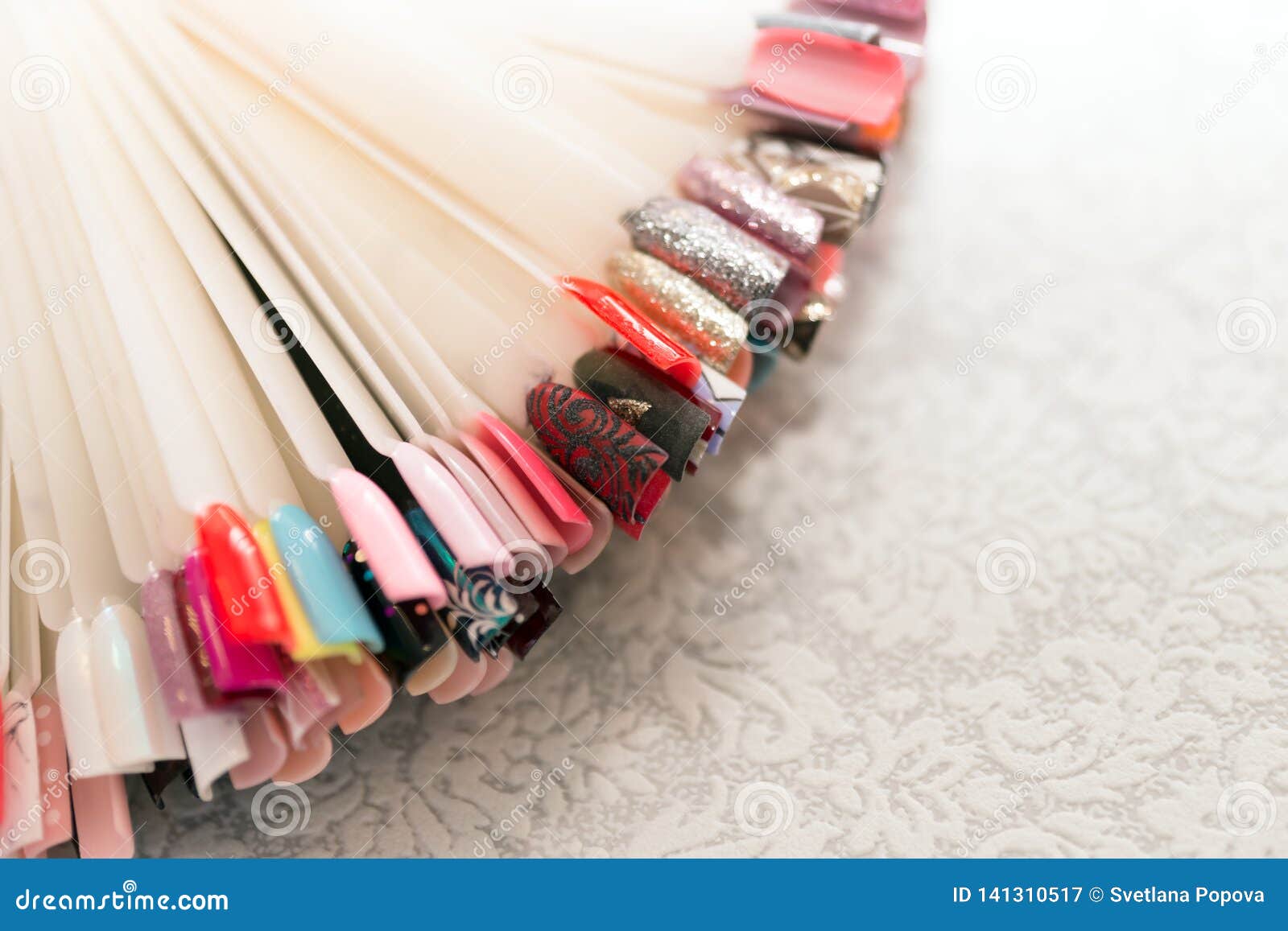 A Collection of Plastic Multicolored Nail Samples for Manicure Lies ...