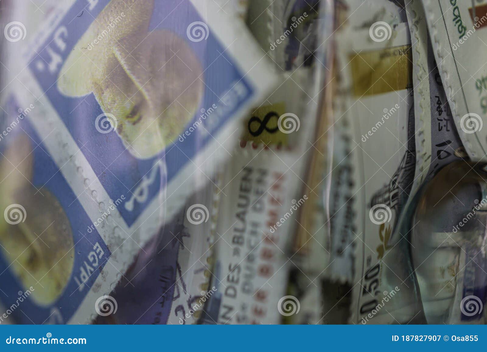 Collection of Postage Stamps in a Jar Editorial Photography - Image of ...