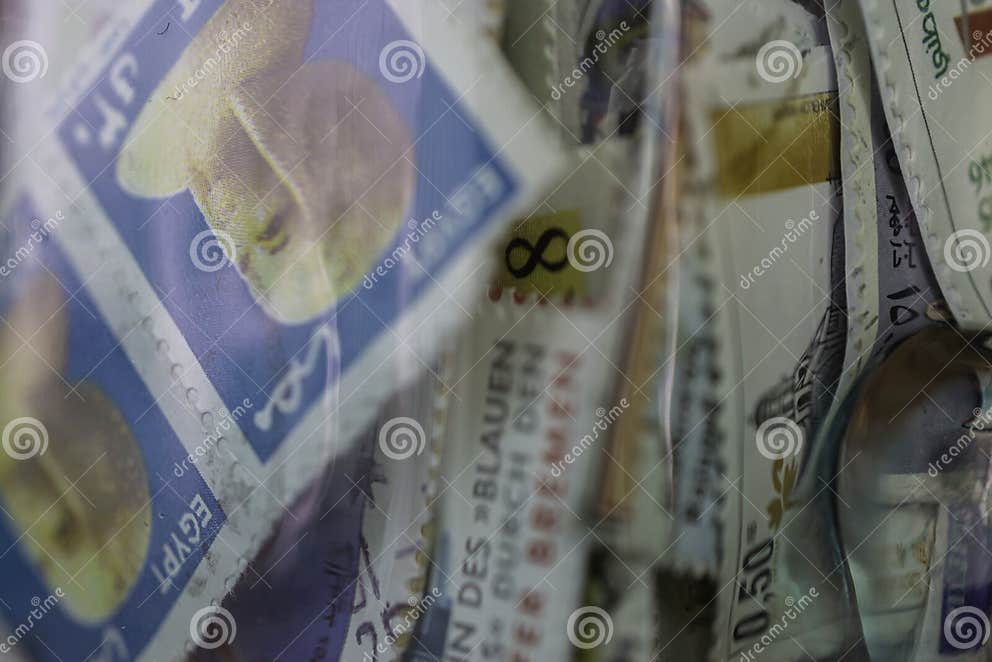 Collection of Postage Stamps in a Jar Editorial Photography - Image of ...