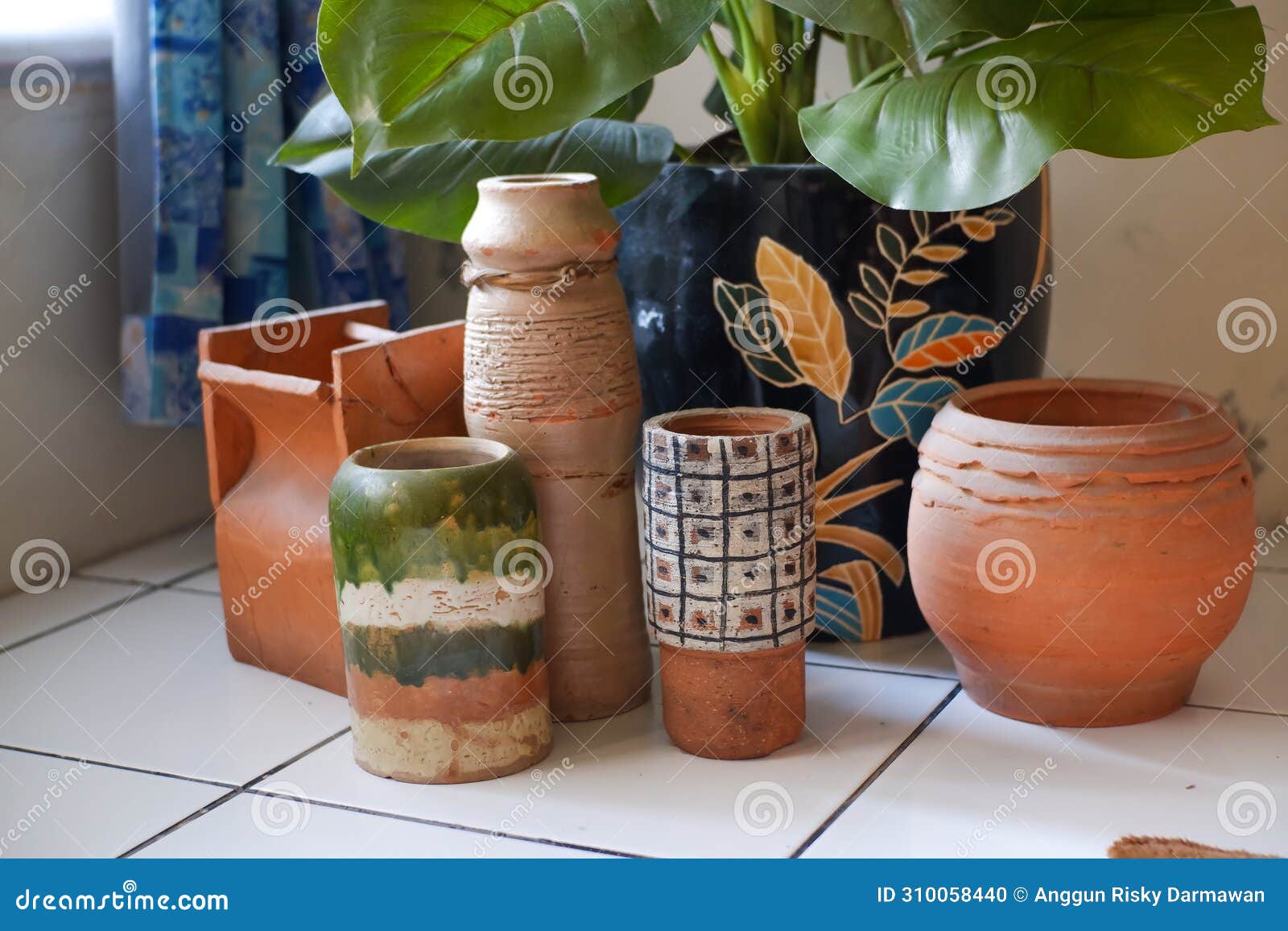 A Collection of Pottery and Clay Products, on Display or in a ...