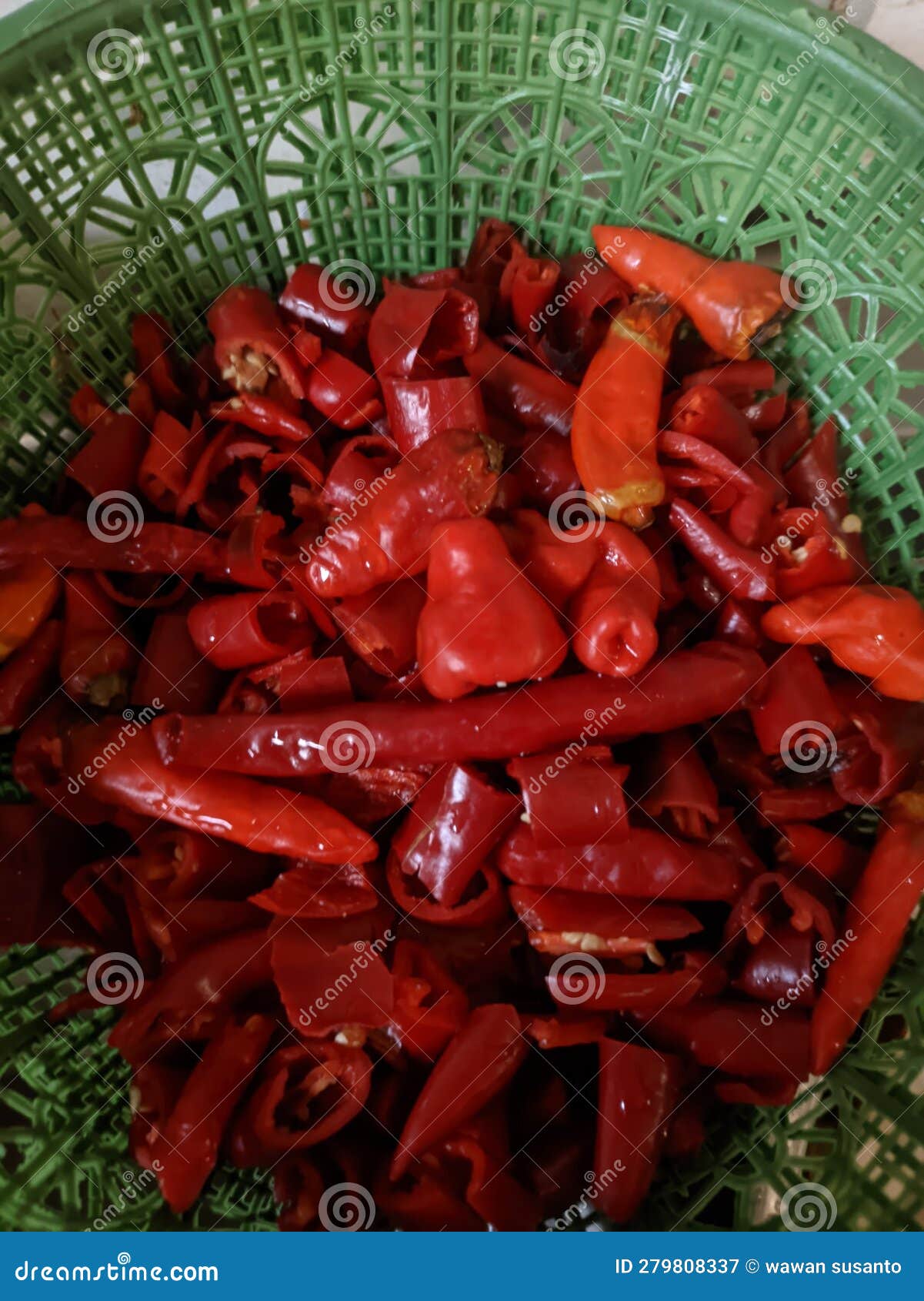 A Collection of Red Chili Pieces in a Plastic Baskets Container Stock ...