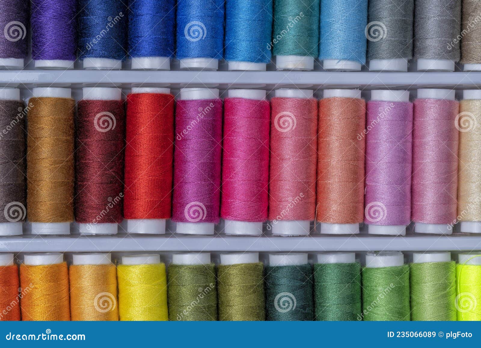 Collection of Sewing Thread Spools with Threads of All Colors Stock ...