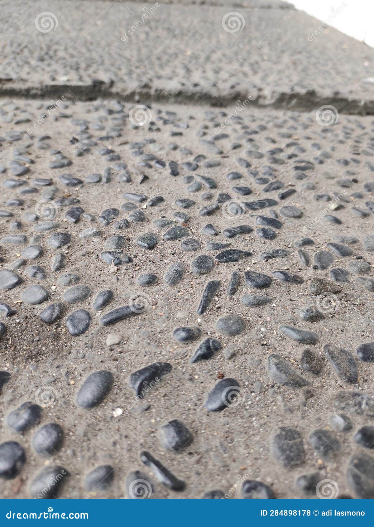 Buried small black stones stock photo. Image of small - 284898178