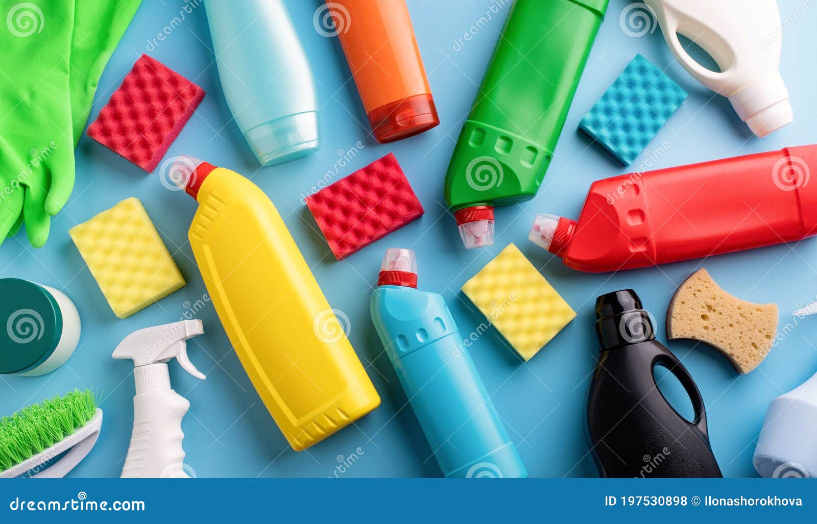 Collection of Various Sanitary Bottles and Cleaning Tools on Solid Blue ...