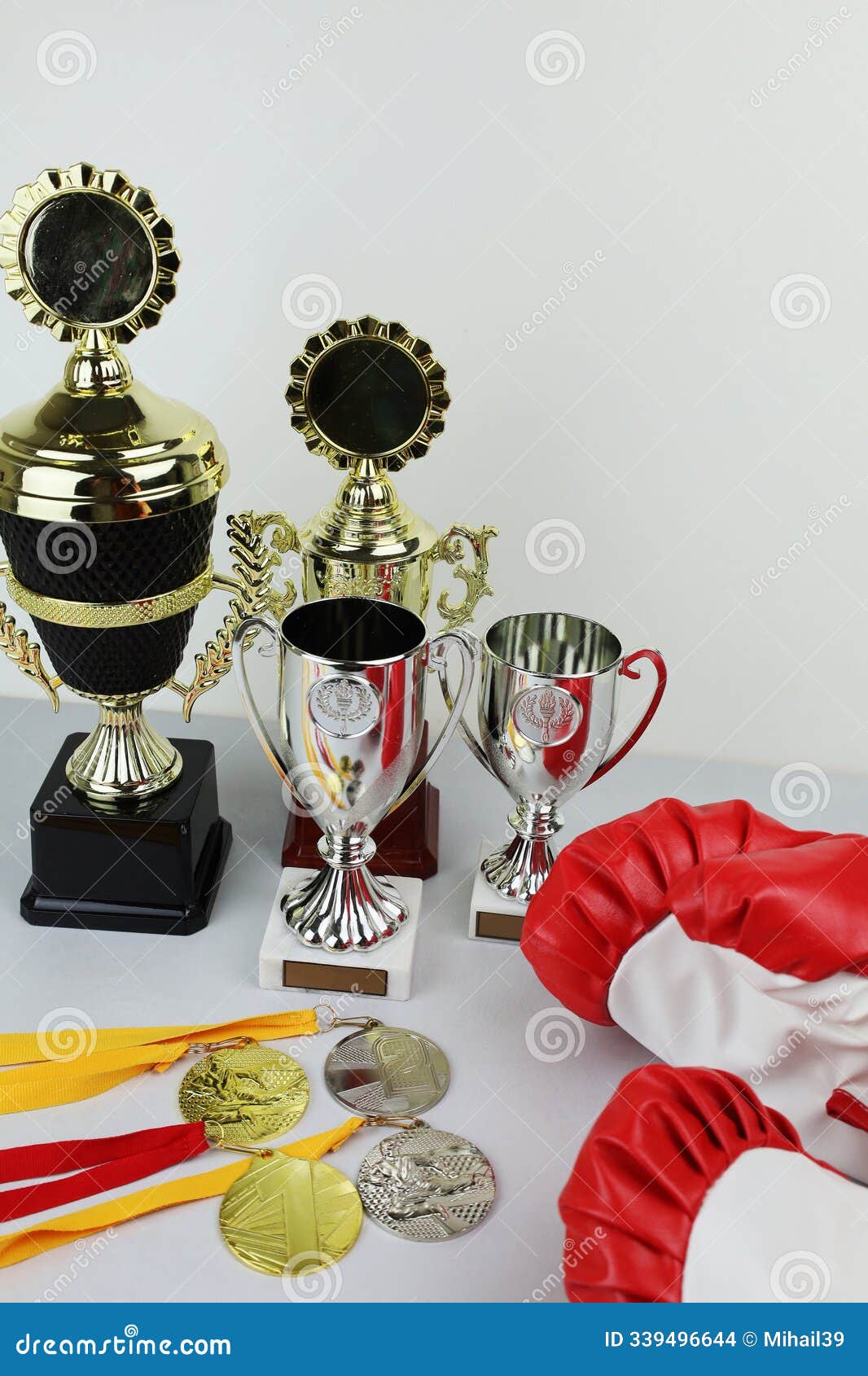 A Collection of Trophies and Medals is Displayed on a Table Stock Photo ...
