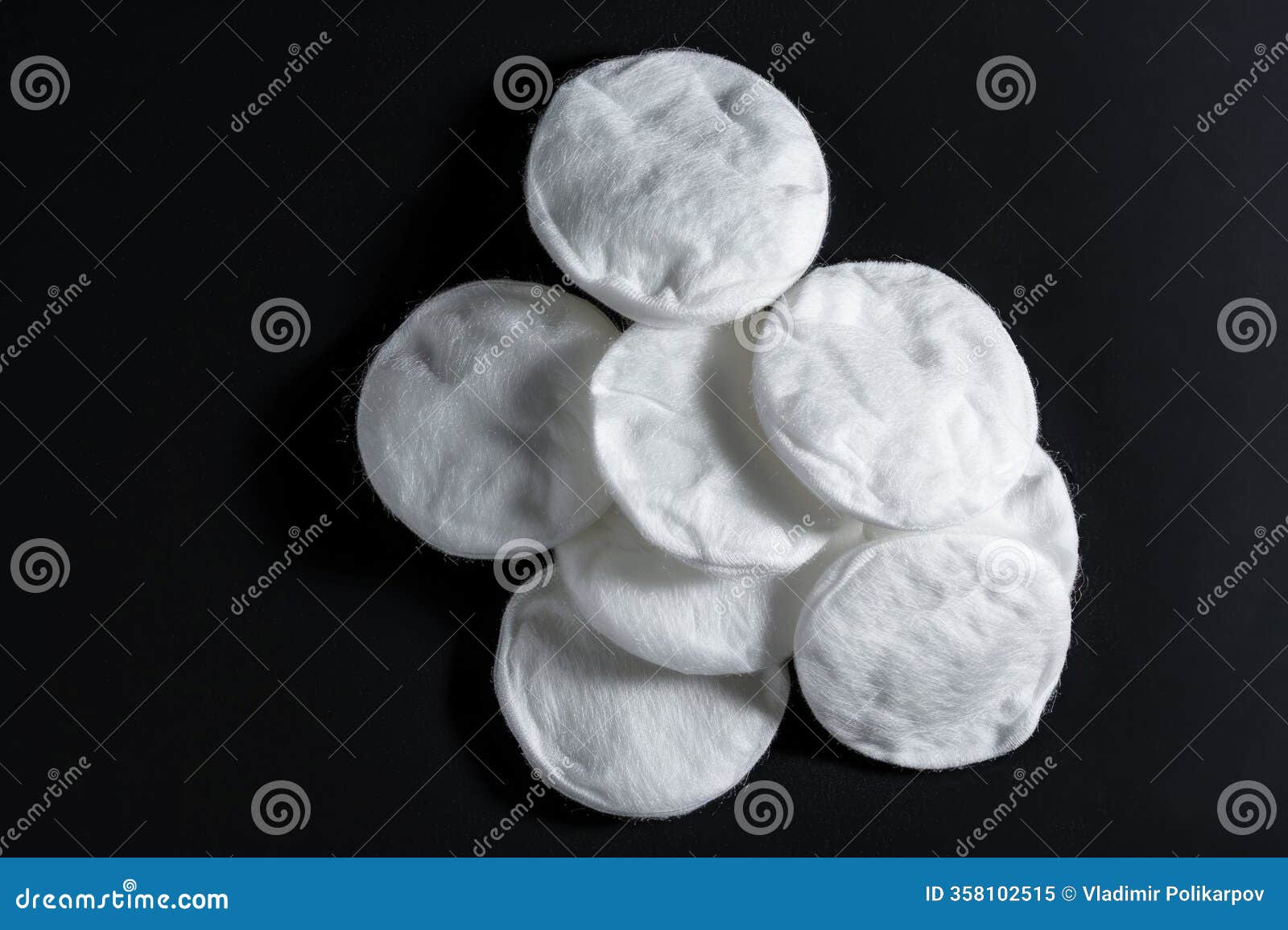 A Collection of White Cotton Rounds on a Black Surface Stock Image ...