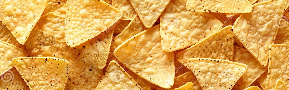 A Collection of Yellow Triangular Corn Tortilla Chips Stacked on Top of ...