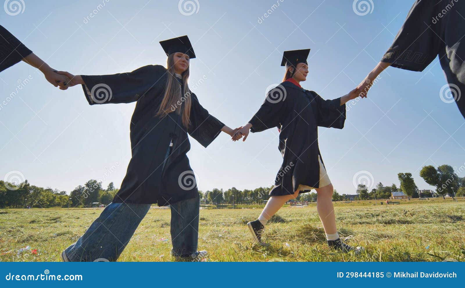 College Graduates Holding Hands Run in a Round Dance. Stock Image ...