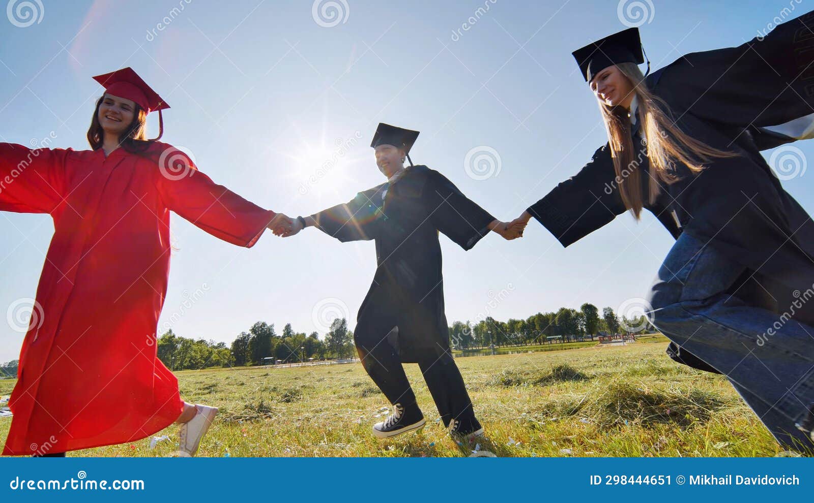 College Graduates Holding Hands Run in a Round Dance. Stock Image ...