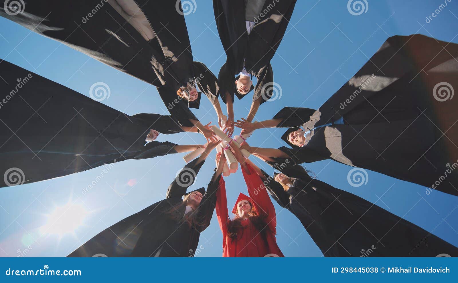 College Graduates Join Hands with Diplomas Standing in a Circle. Stock ...