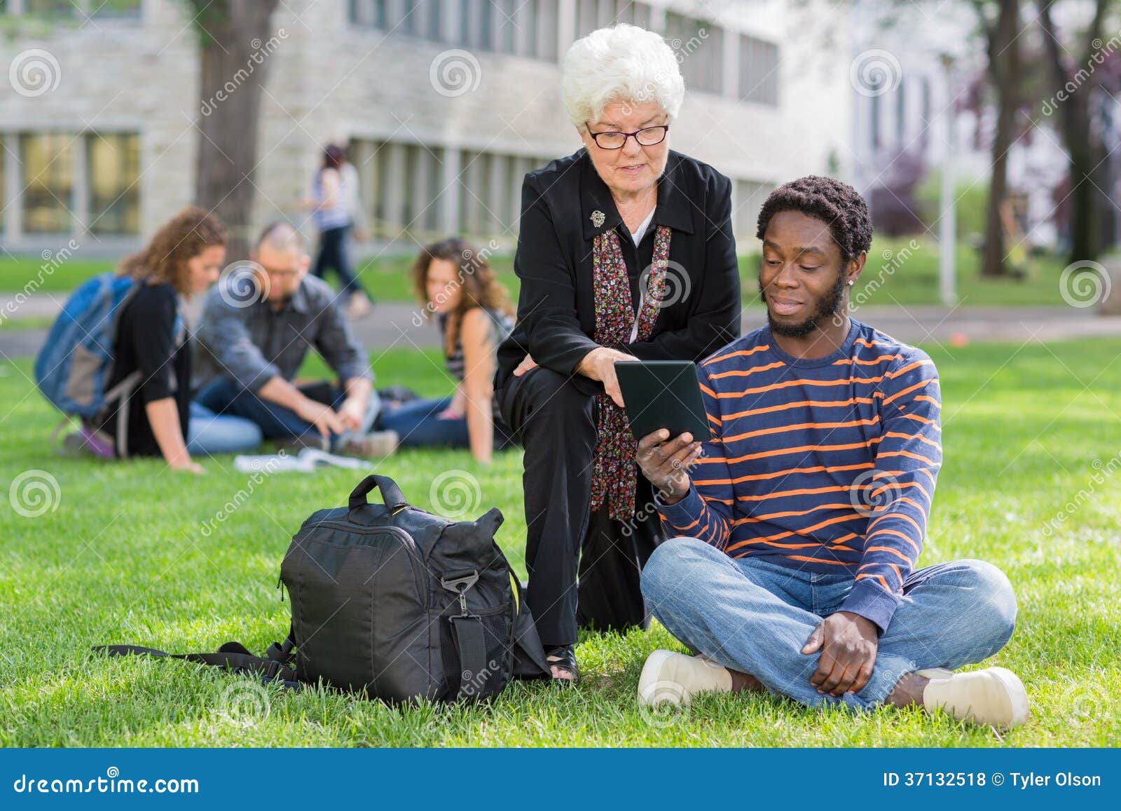 College Professor Helping Student Stock Photo - Image of outdoor, group ...