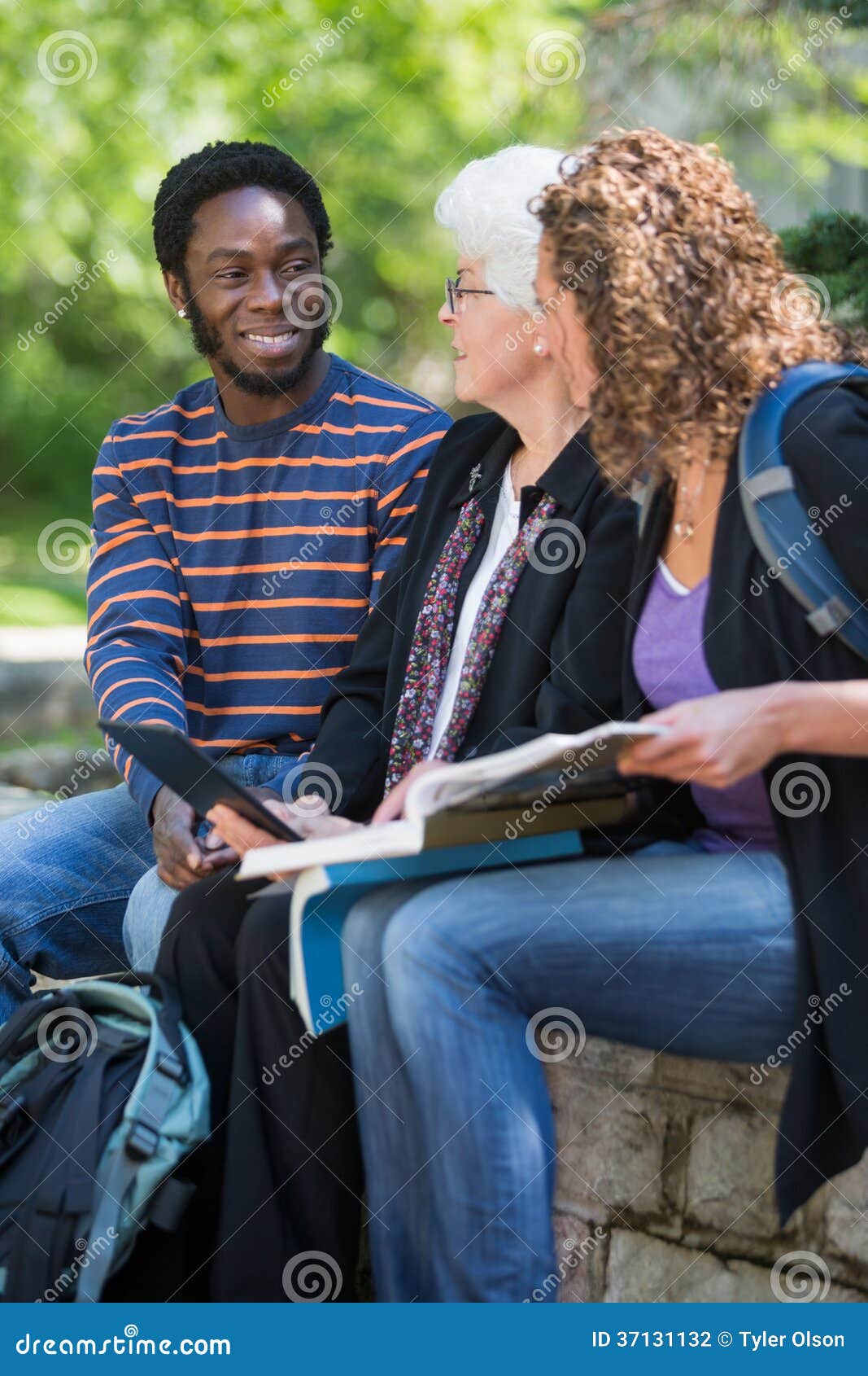 College Professor Helping Students Stock Photo - Image of happy ...