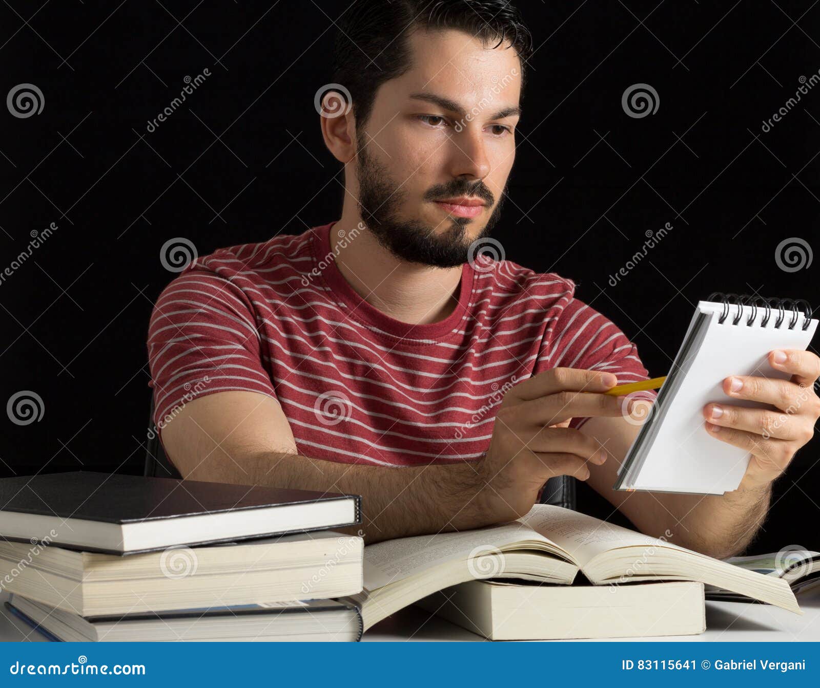 College Student Checking Notes Stock Image - Image of sitting, checking ...