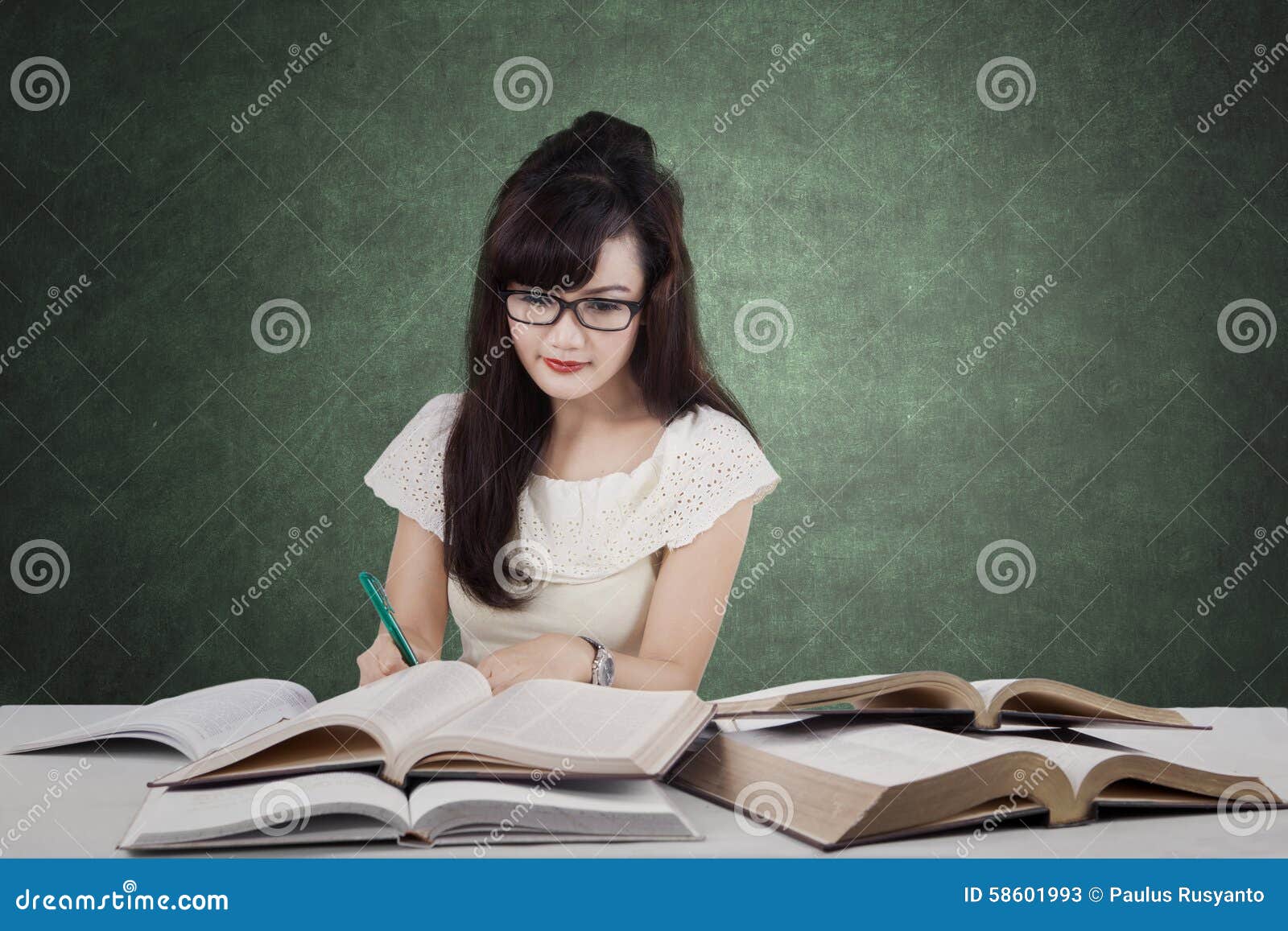 College Student Doing Assignment in the Class Stock Image - Image of ...
