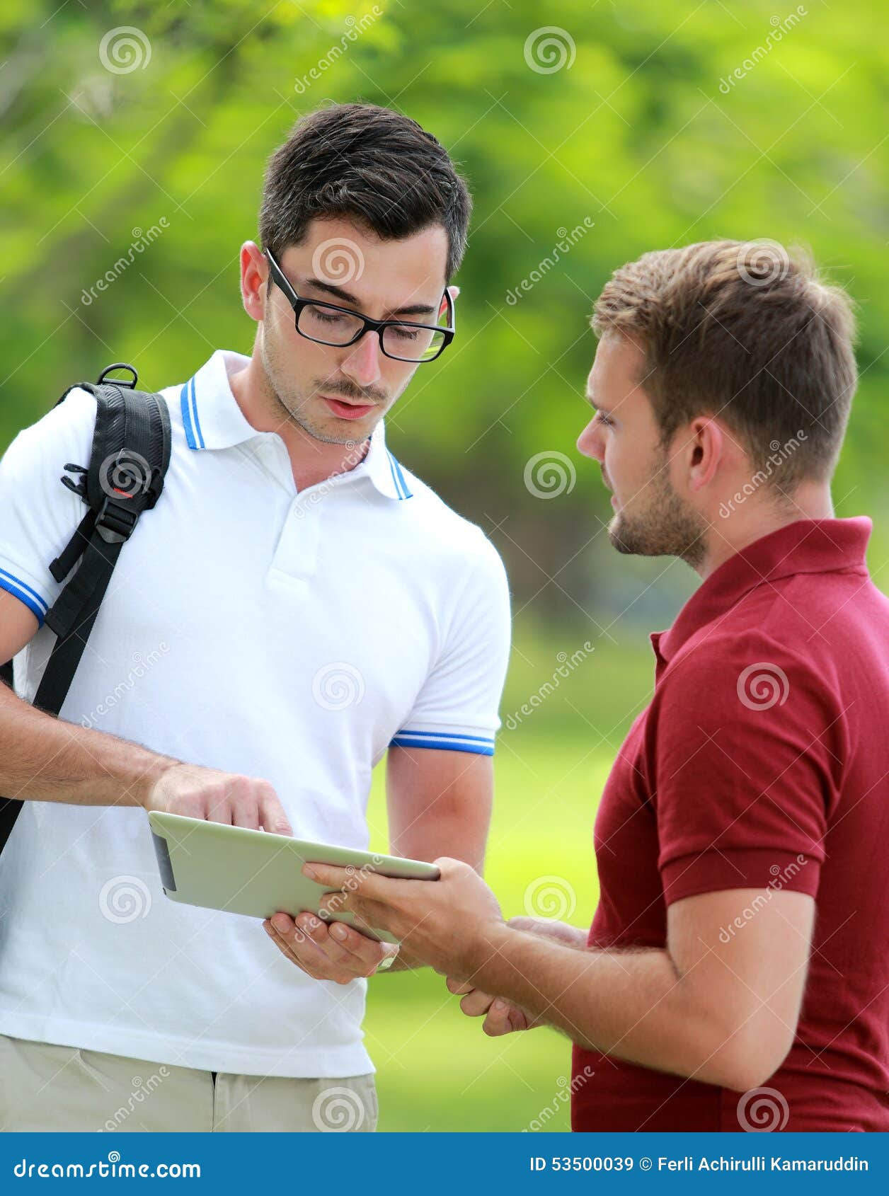 A College Student Explaining about an Assignment To His Friend U Stock ...