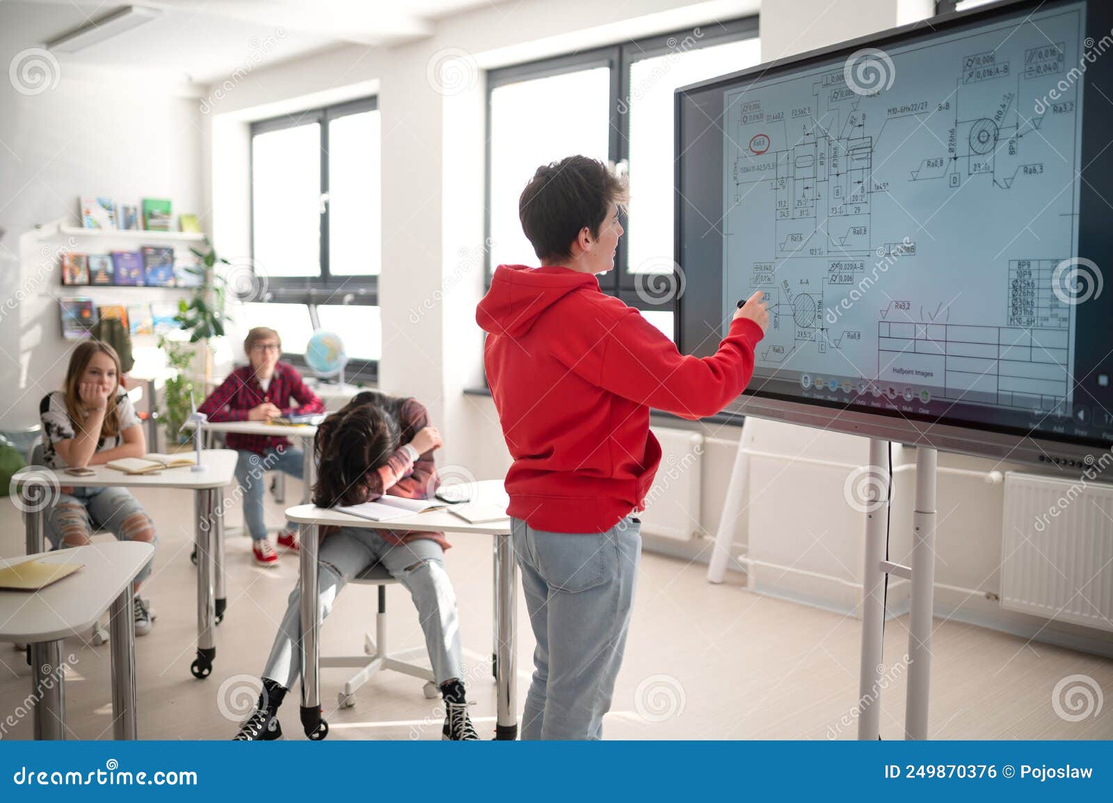 College Student Explaining Some Ideas on a Touch TV in Classroom. Stock ...