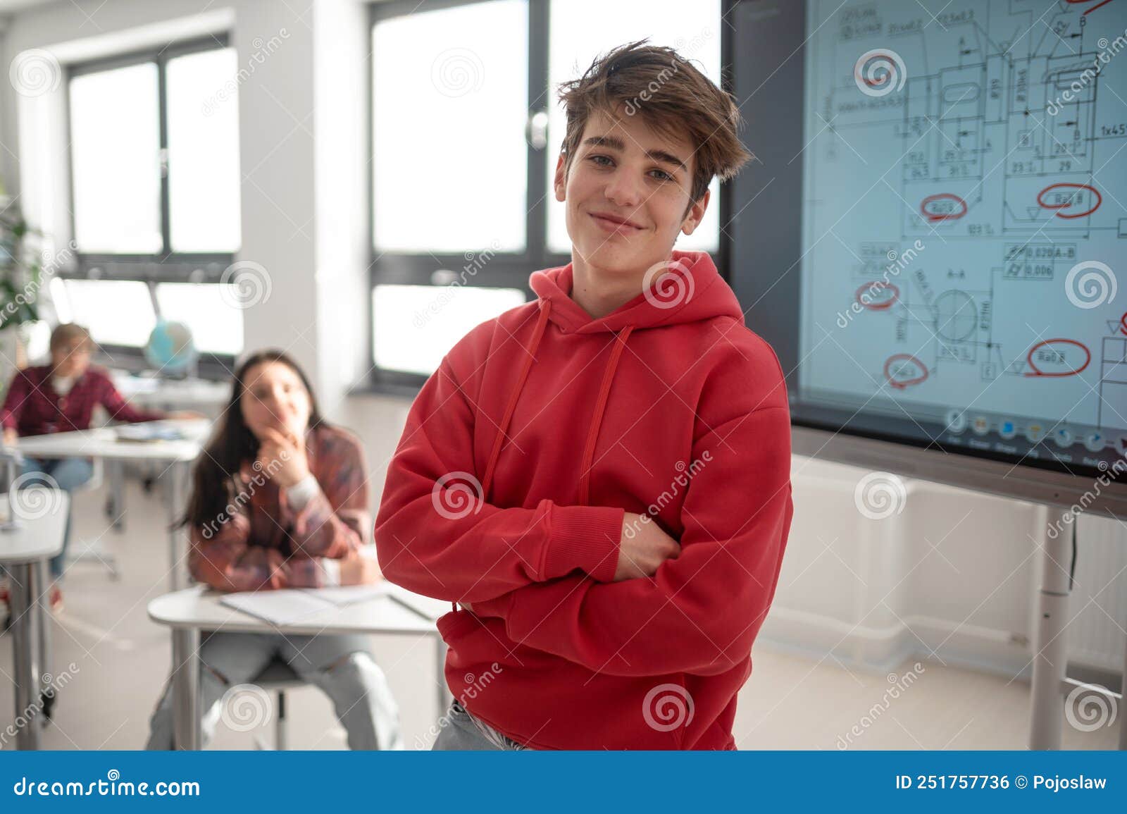 College Student Explaining Some Ideas on a Touch TV in Classroom ...