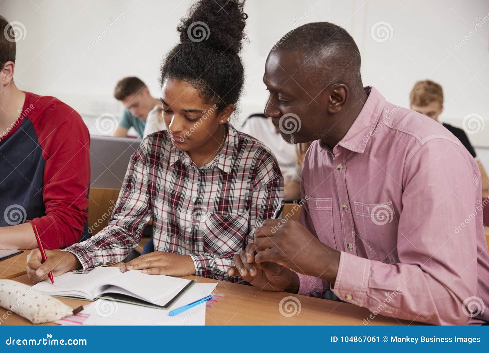 College Student Has Individual Tuition from Teacher in Classroom Stock ...