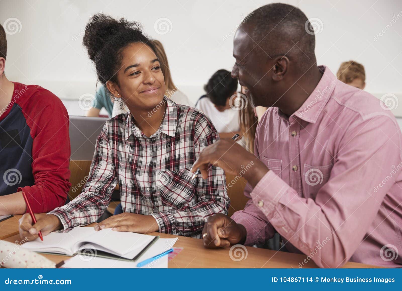 College Student Has Individual Tuition from Teacher in Classroom Stock ...