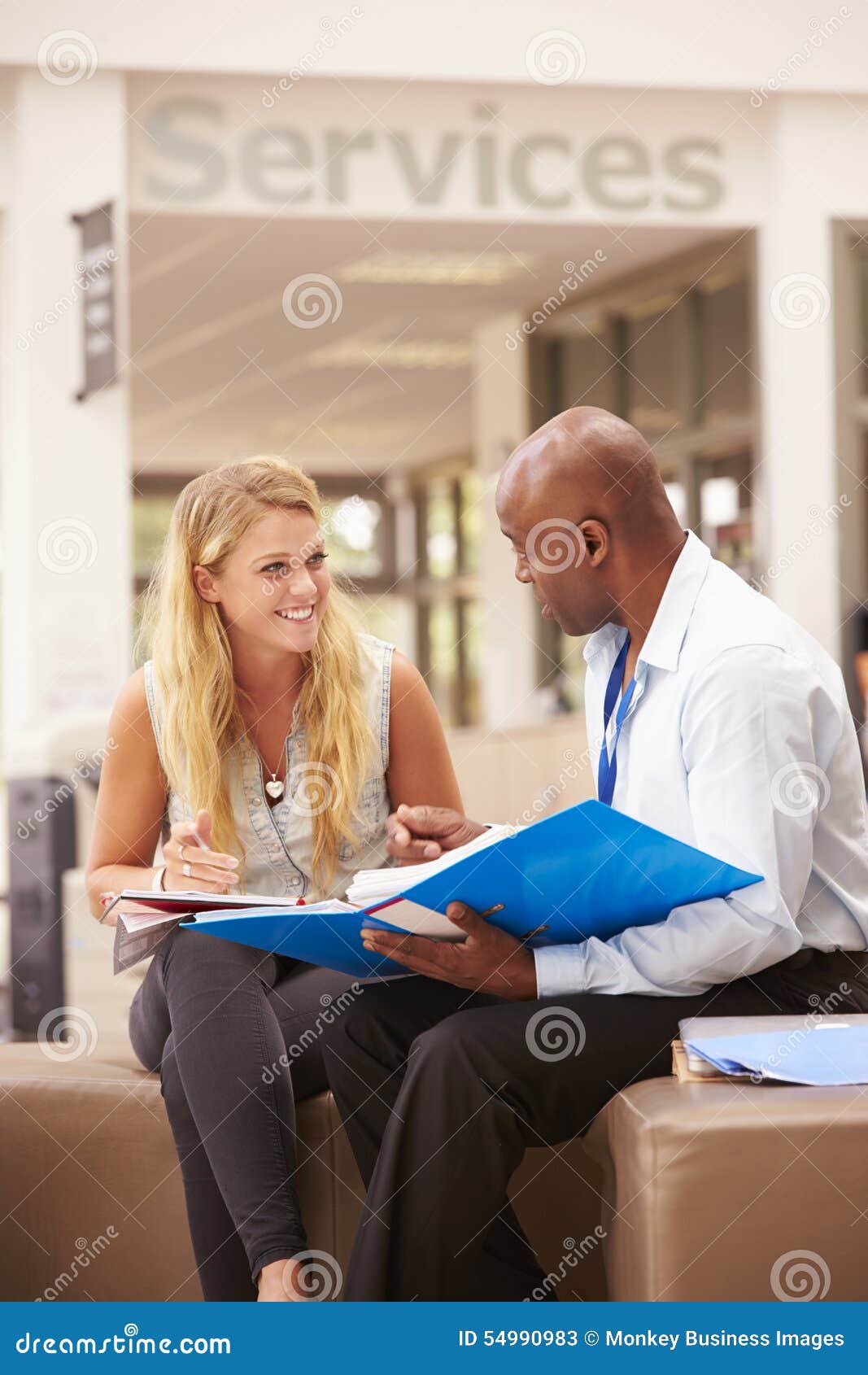 College Student Having Meeting with Tutor To Discuss Work Stock Image ...