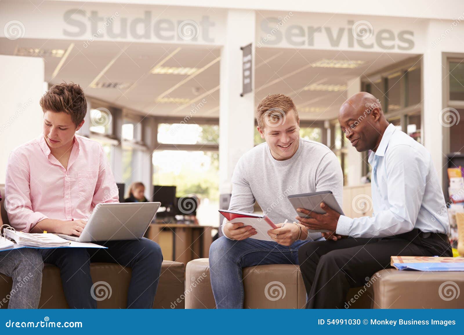 College Student Having Meeting with Tutor To Discuss Work Stock Photo ...