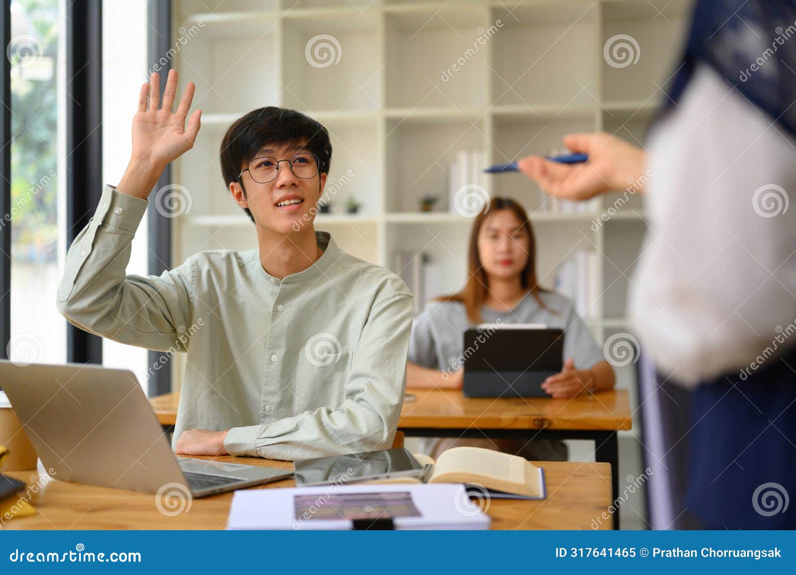 College Student Man Raising His Hand To Answer Question or Ask ...