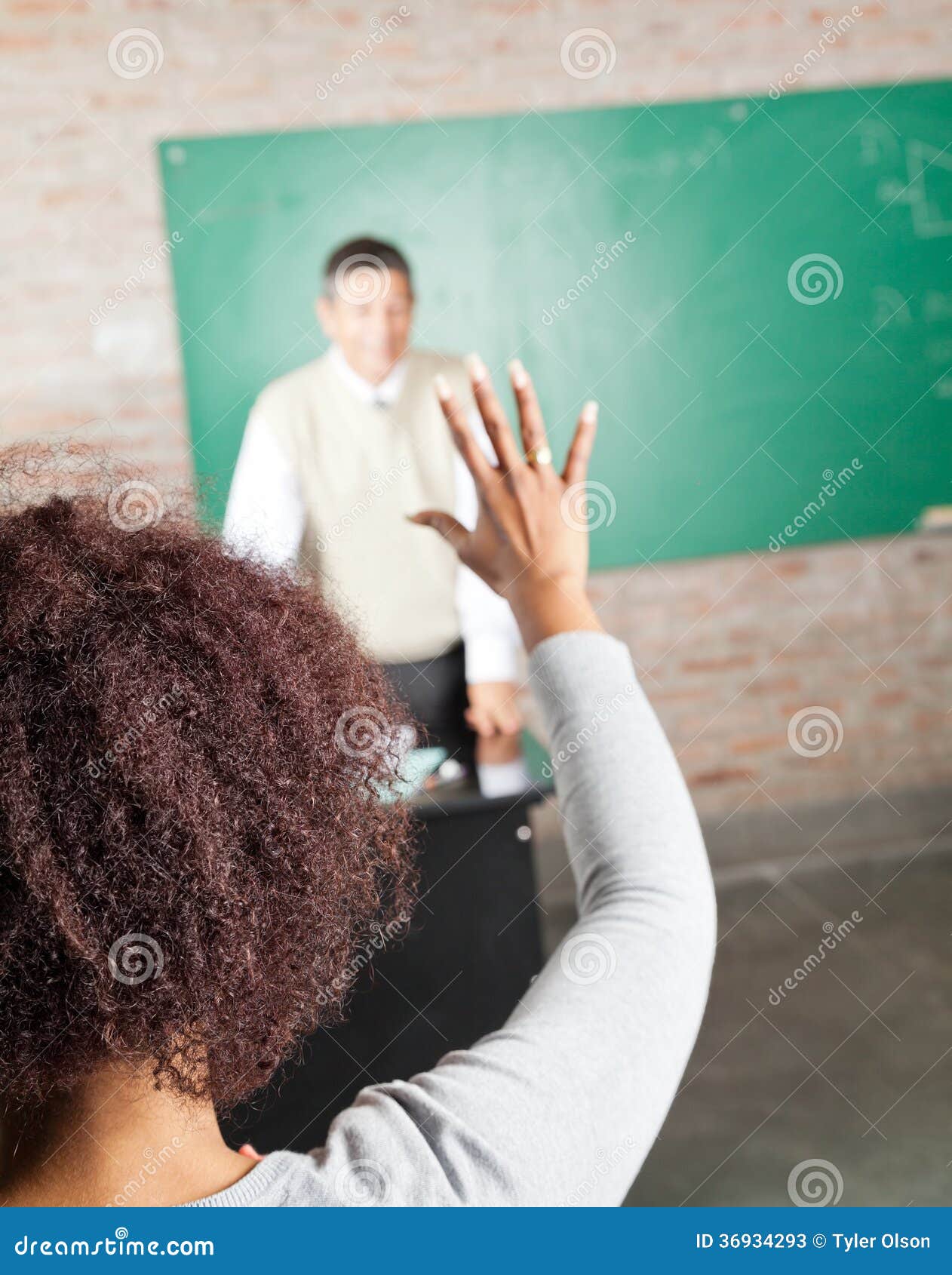 College Student Raising Hand To Answer in Stock Image - Image of ...