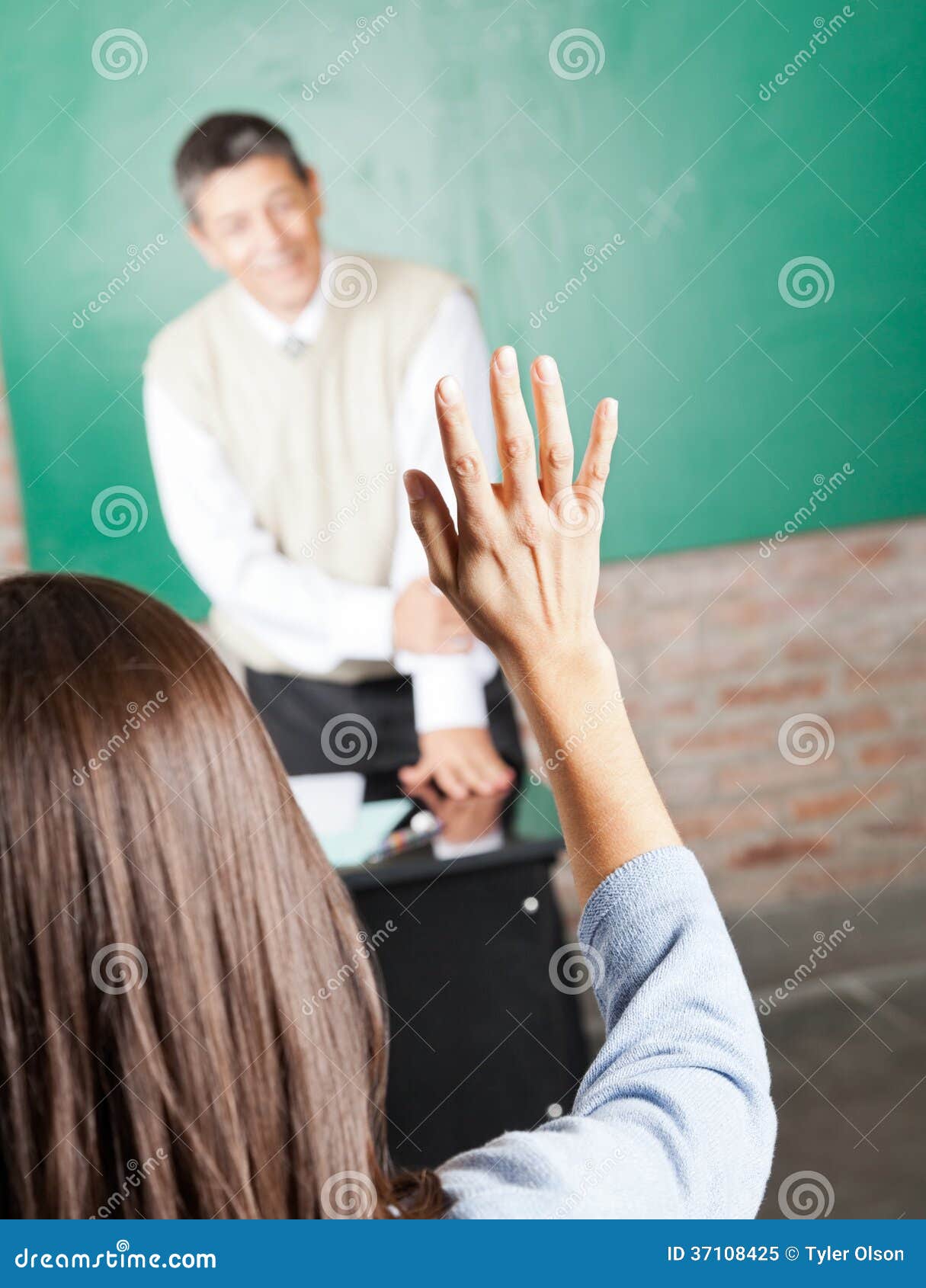 College Student Raising Hand To Answer in Stock Image - Image of ...