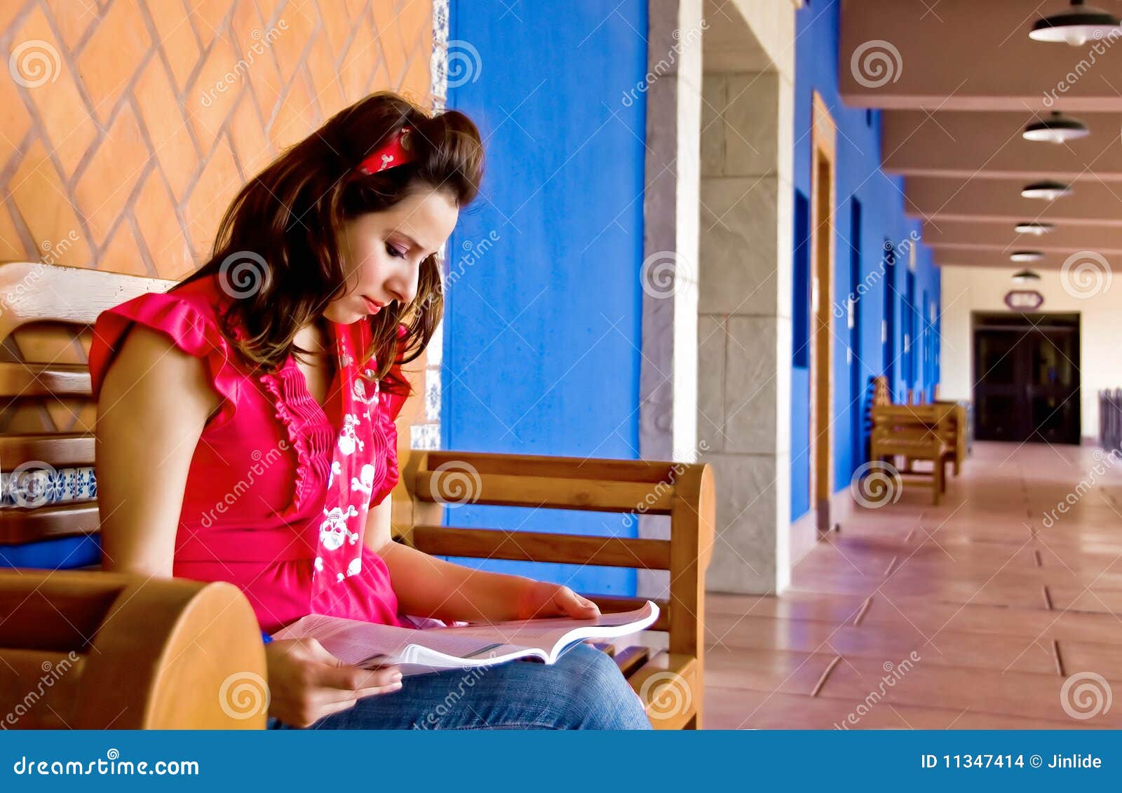 College Student Reading in the Hallway Stock Photo - Image of ...