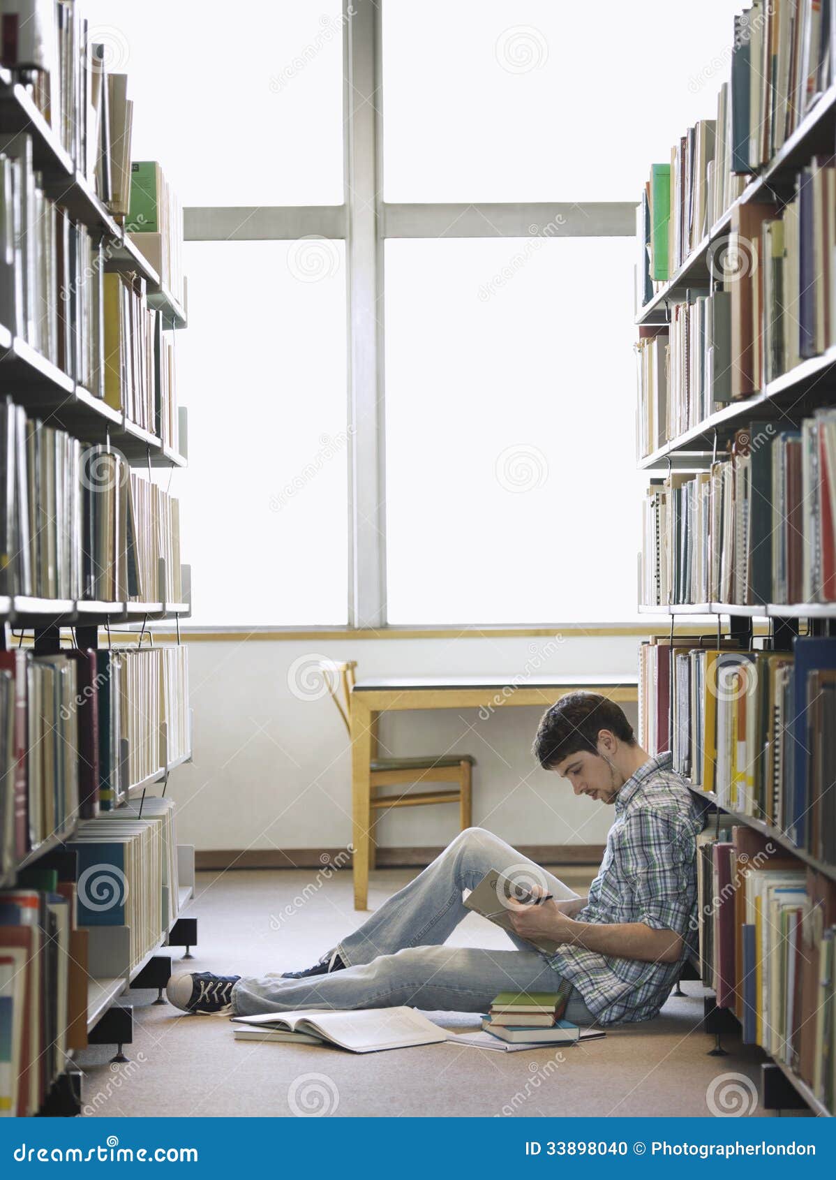 College Student Reading in Library Stock Photo - Image of casual ...