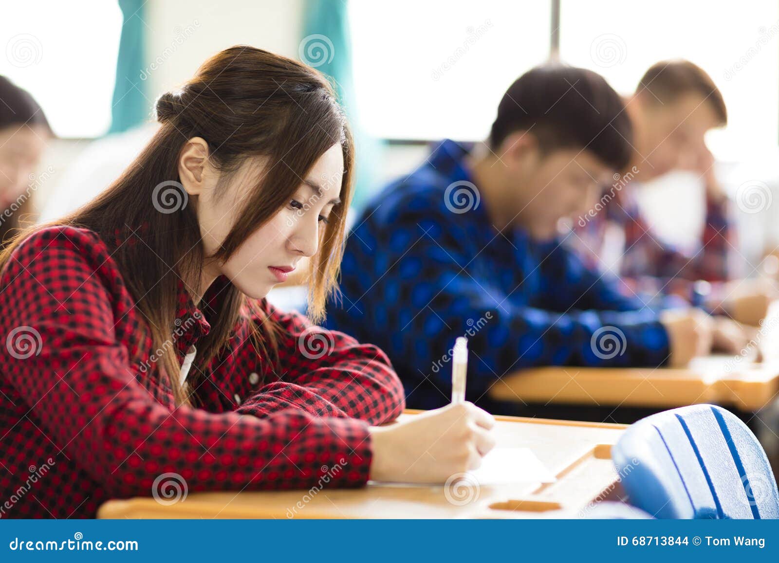 College Student Sitting and Exam in the Classroom Stock Photo - Image ...
