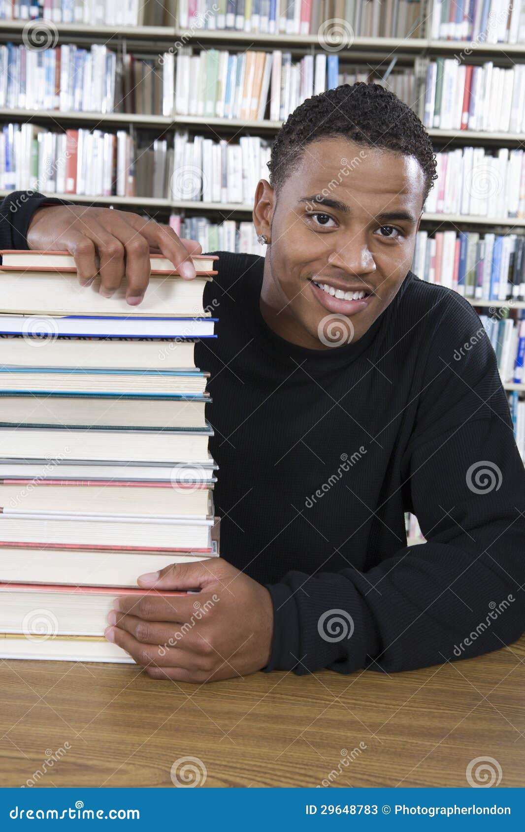 College Student Sitting with Stack of Books Stock Image - Image of ...