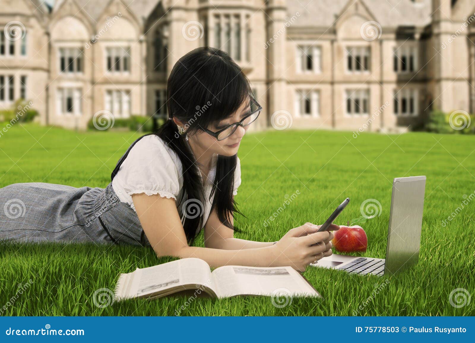 College Student Texting at Field Stock Image - Image of outdoor, fruit ...