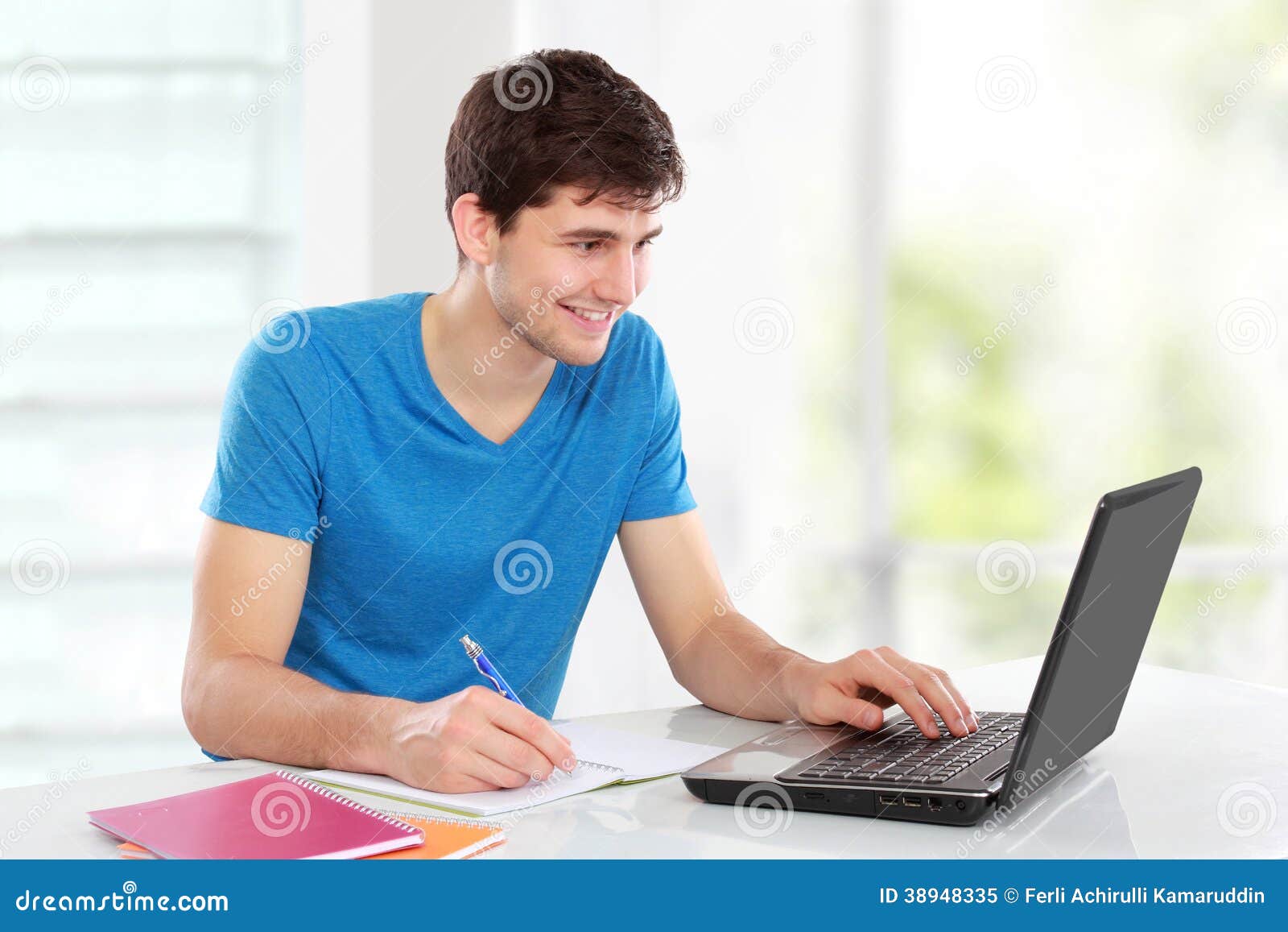 College Student Using His Laptop Stock Image - Image of laptop, person ...