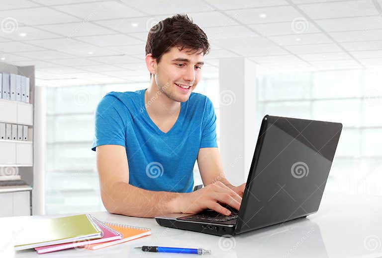College Student Using His Laptop Stock Photo - Image of modern, male ...