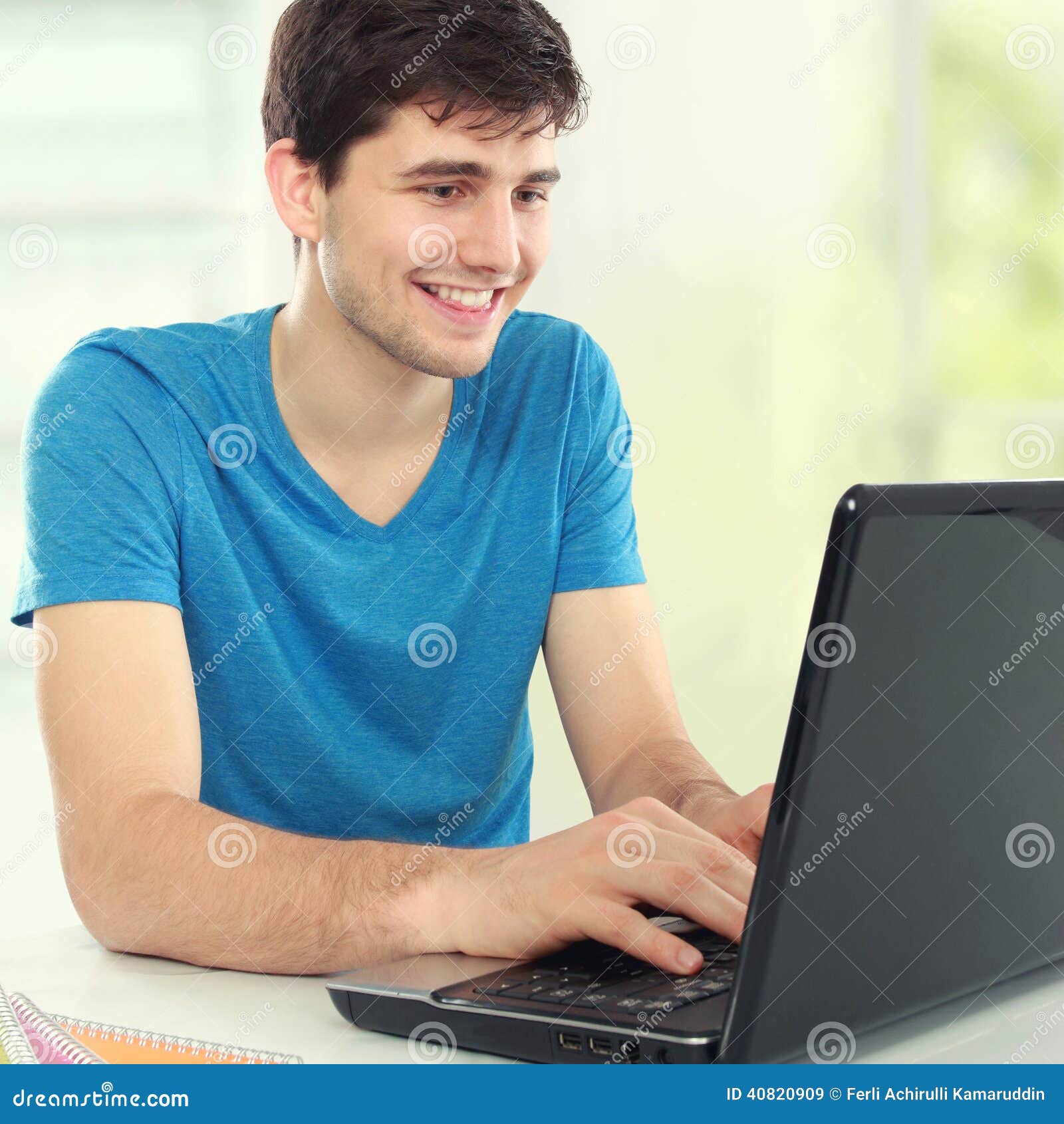 College Student Using His Laptop Stock Image - Image of high, smiling ...