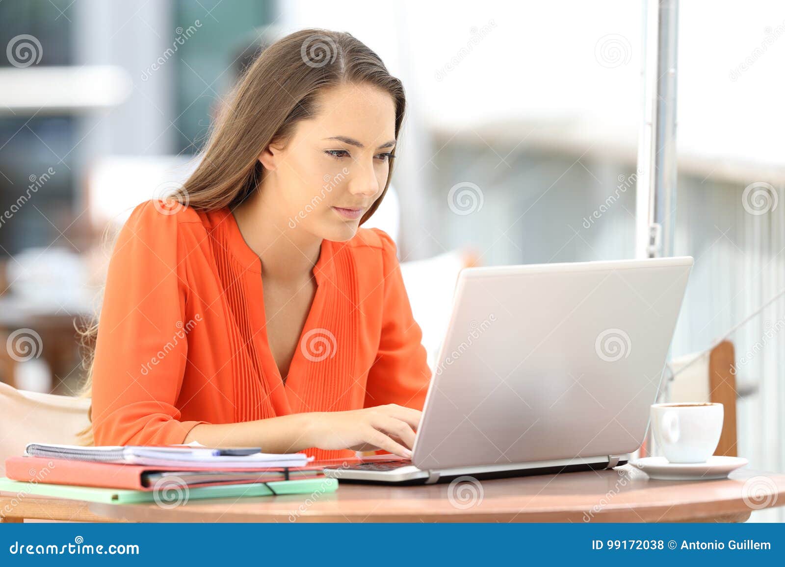 College Student Using a Laptop in a Coffee Shop Stock Photo - Image of ...