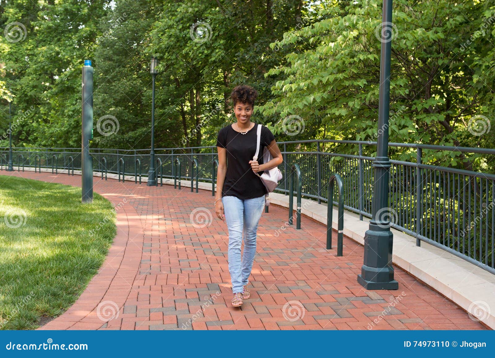 A College Student Walking on Campus Stock Photo - Image of education ...