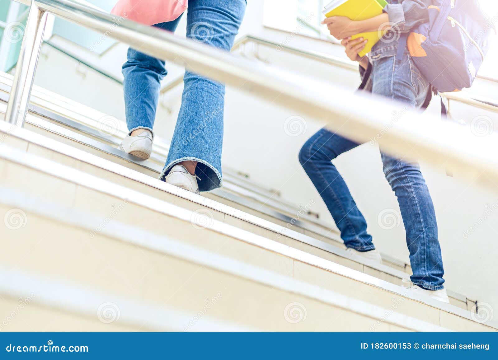 College Student Walking Up the Staircase Stock Image - Image of ...