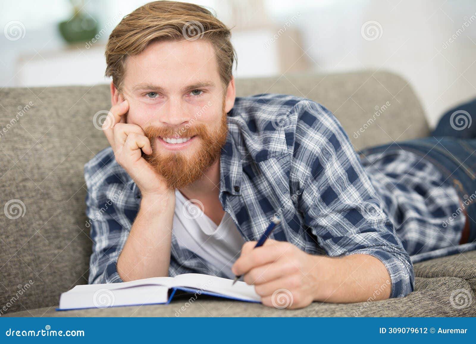 College Student Writing Down Note on Sofa Stock Photo - Image of ...