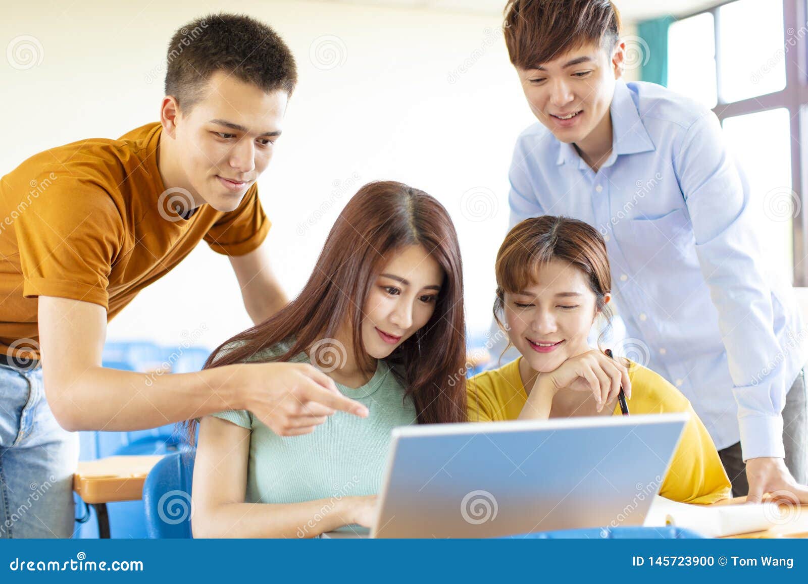 College Students Discussing Ideas in Classroom Stock Photo - Image of ...