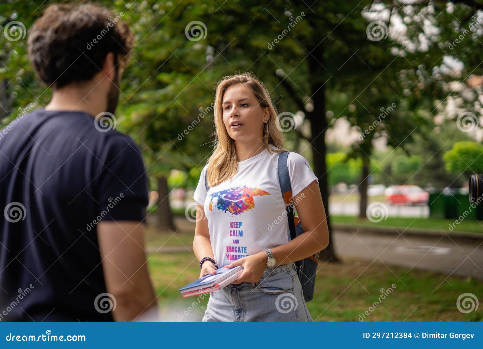 College Students Discussing at the Park, Exchanging Ideas and Solutions ...