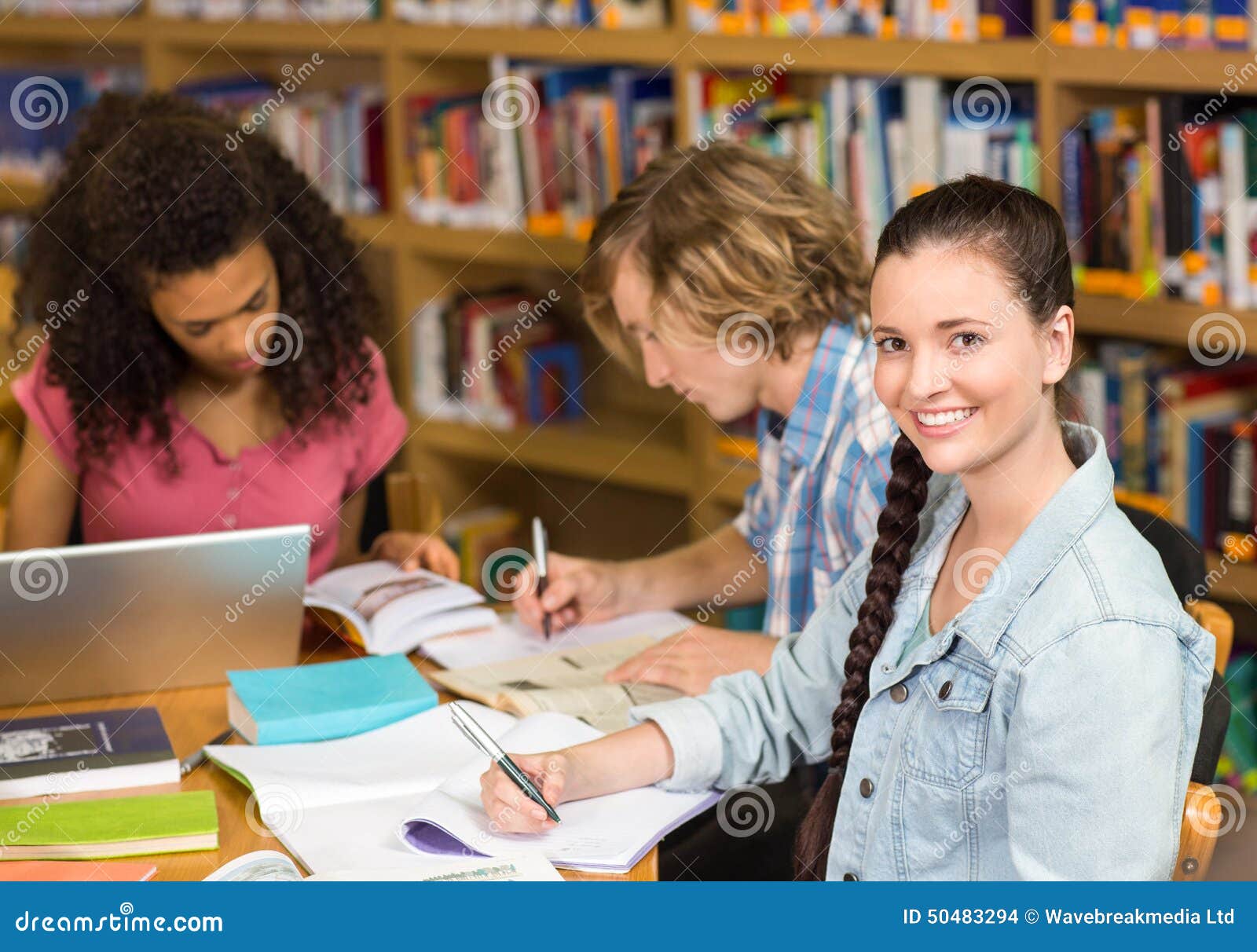 College Students Doing Homework in Library Stock Photo - Image of adult ...