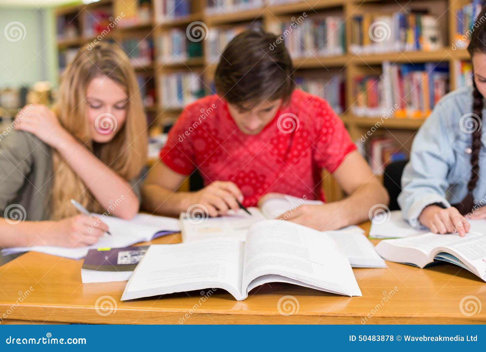 College Students Doing Homework in Library Stock Photo - Image of group ...