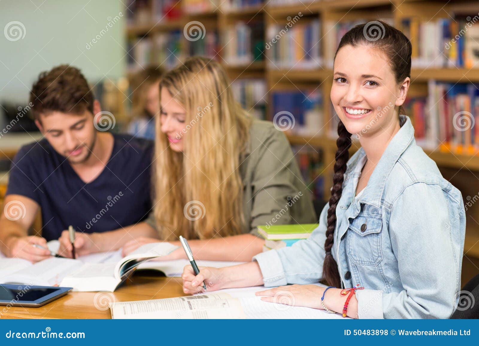 College Students Doing Homework in Library Stock Photo - Image of adult ...