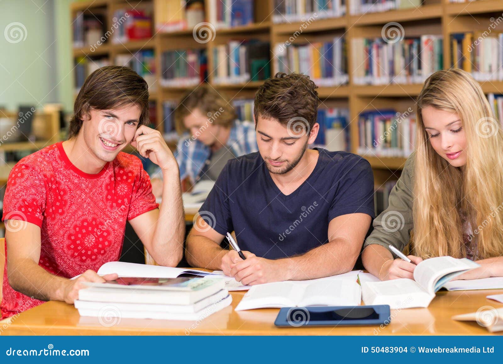 College Students Doing Homework in Library Stock Photo - Image of four ...