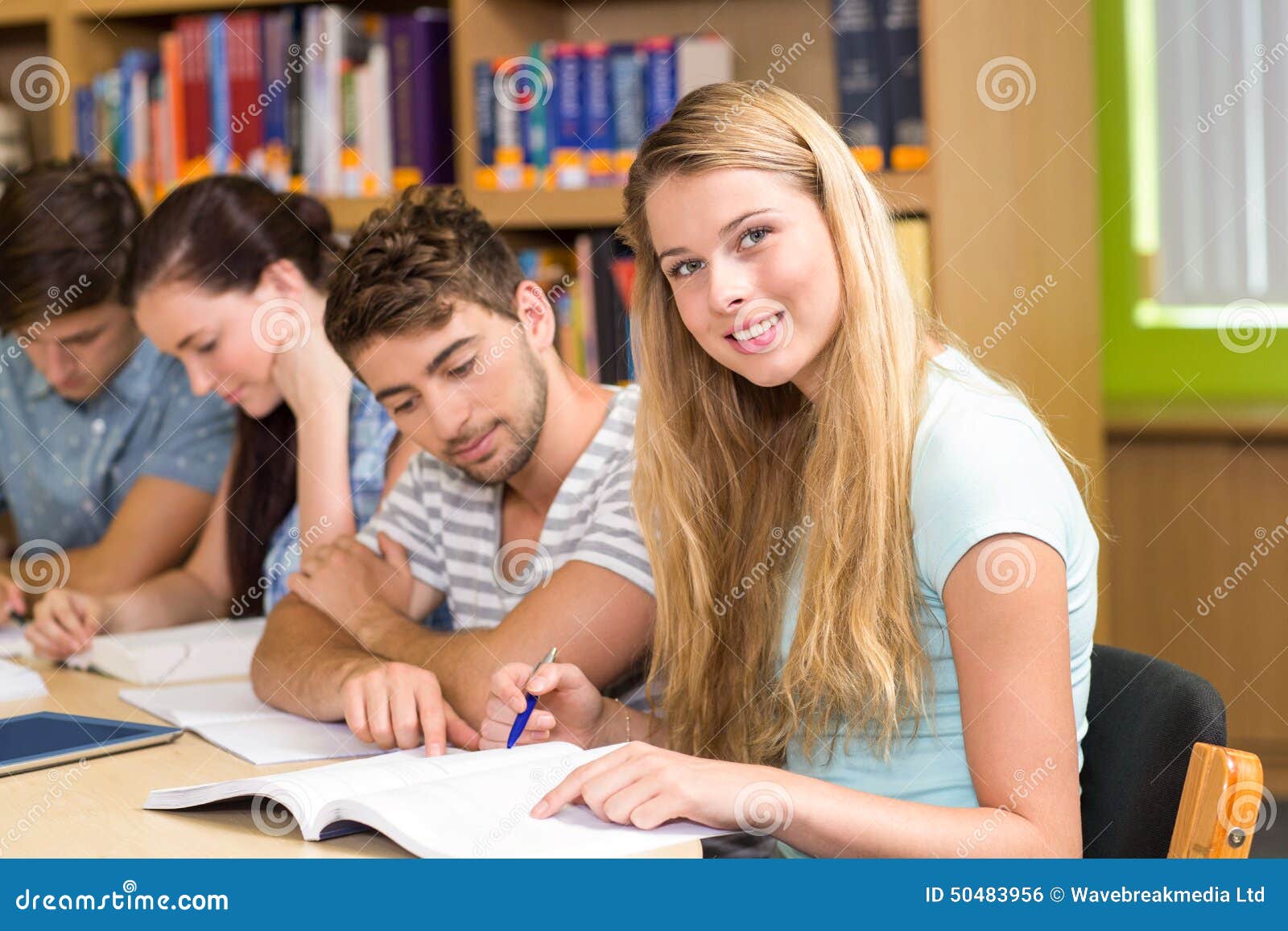 College Students Doing Homework in Library Stock Photo - Image of ...